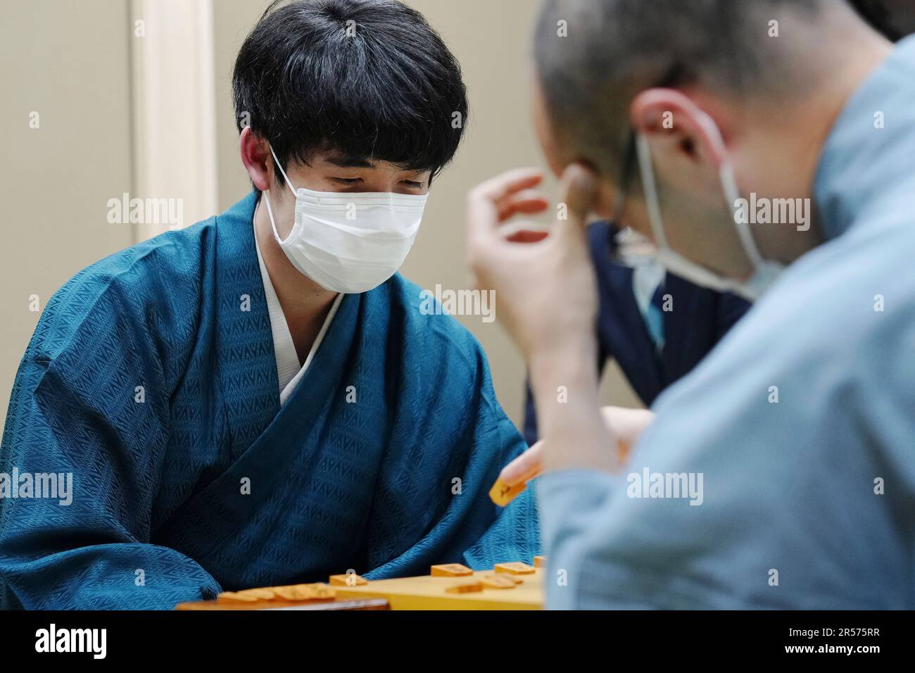 Shogi player Sota Fujii (L) speaks about his new "Meijin" title during ...