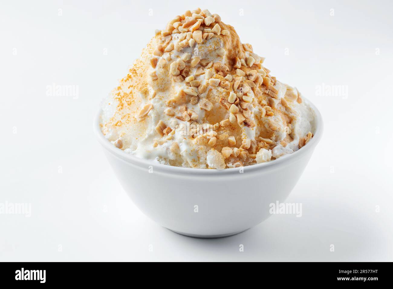 Korean shaved ice dessert with sweet toppings, peanut Bingsu on wood ...