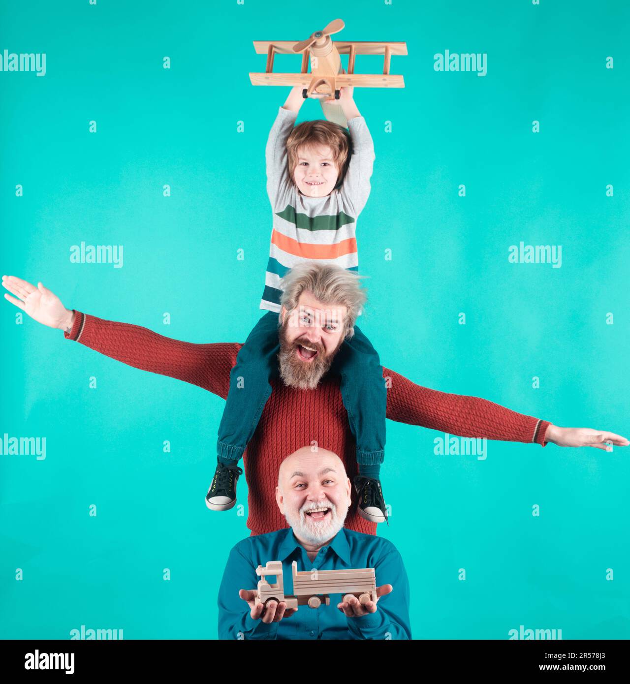 Men generation: grandfather father and grandson playing with toy plane ...
