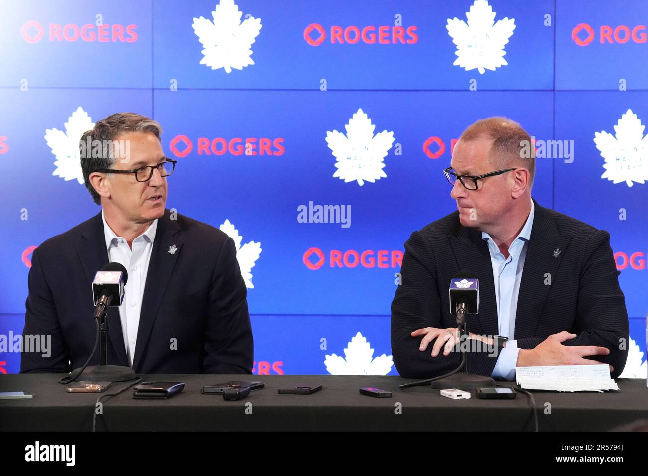 Toronto Maple Leafs' new general manager Brad Treliving, right and team ...