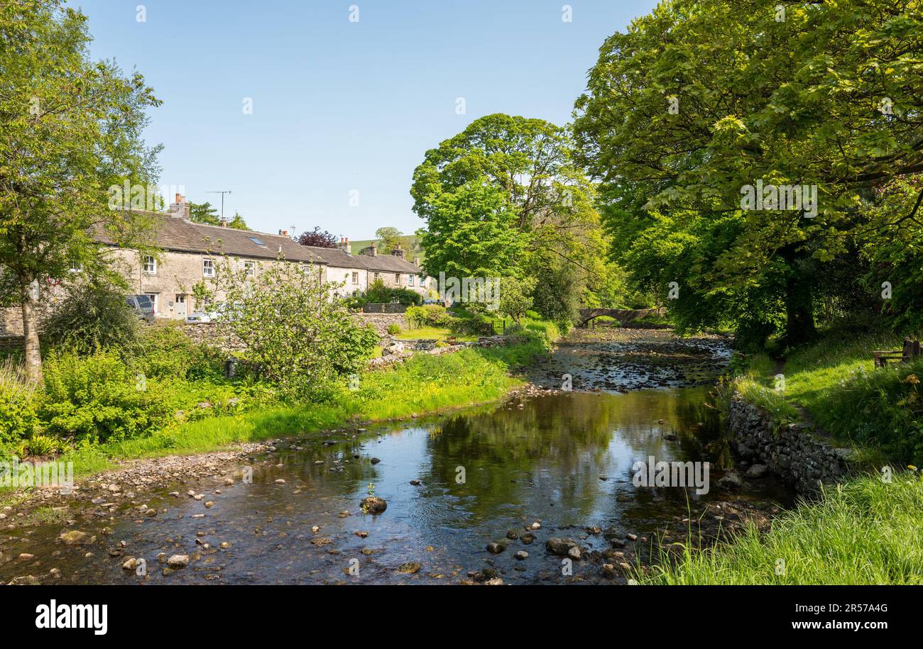 The small country Yorkshire village Clapham with historic stone built ...