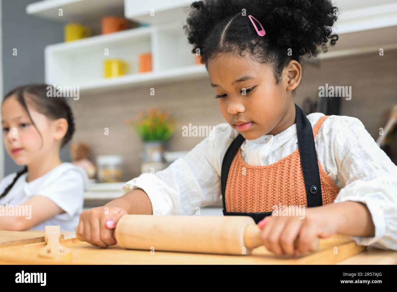 Kids playing flour in kitchen hi-res stock photography and images - Alamy