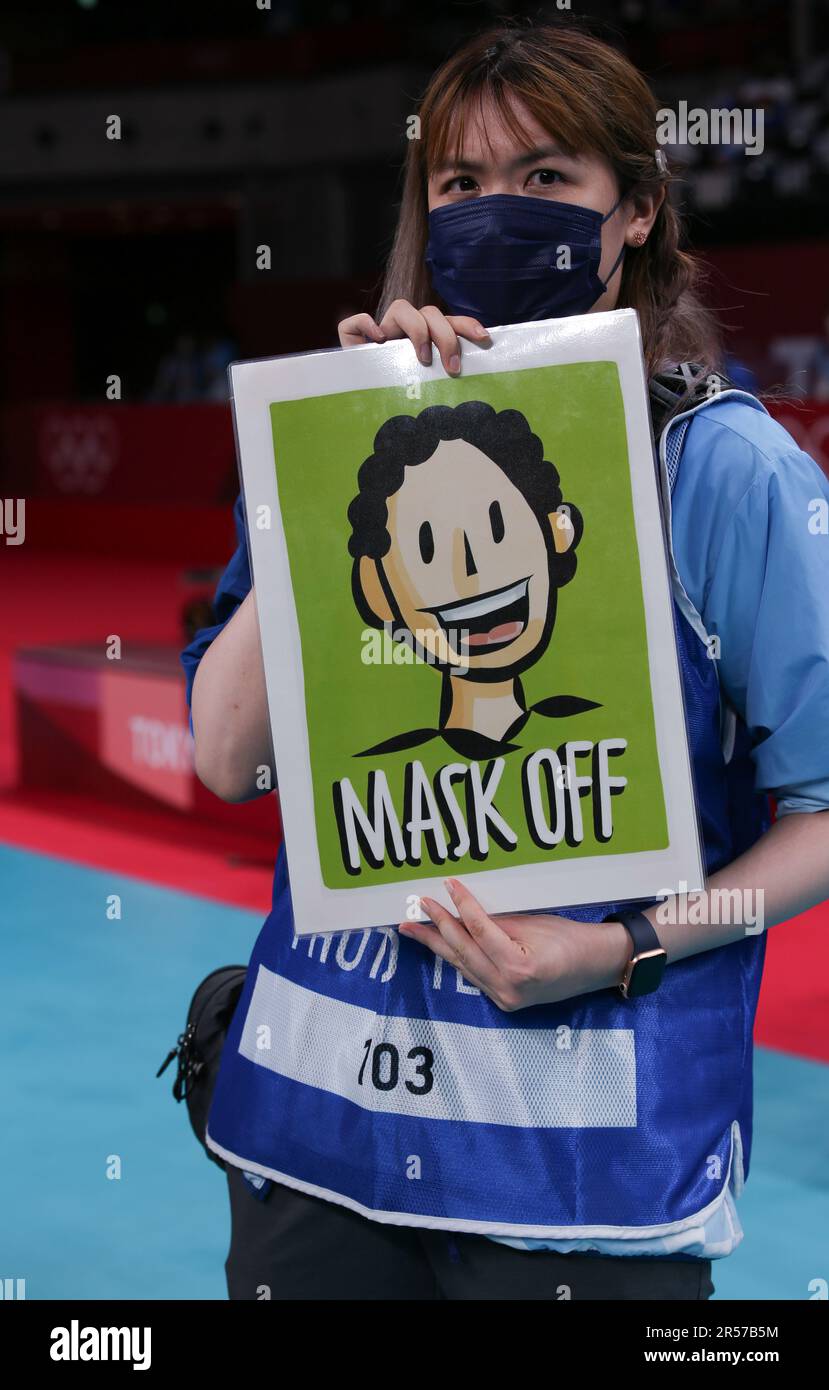 AUG 7, 2021 - Tokyo, Japan: a volunteer shows medalists they can now ...