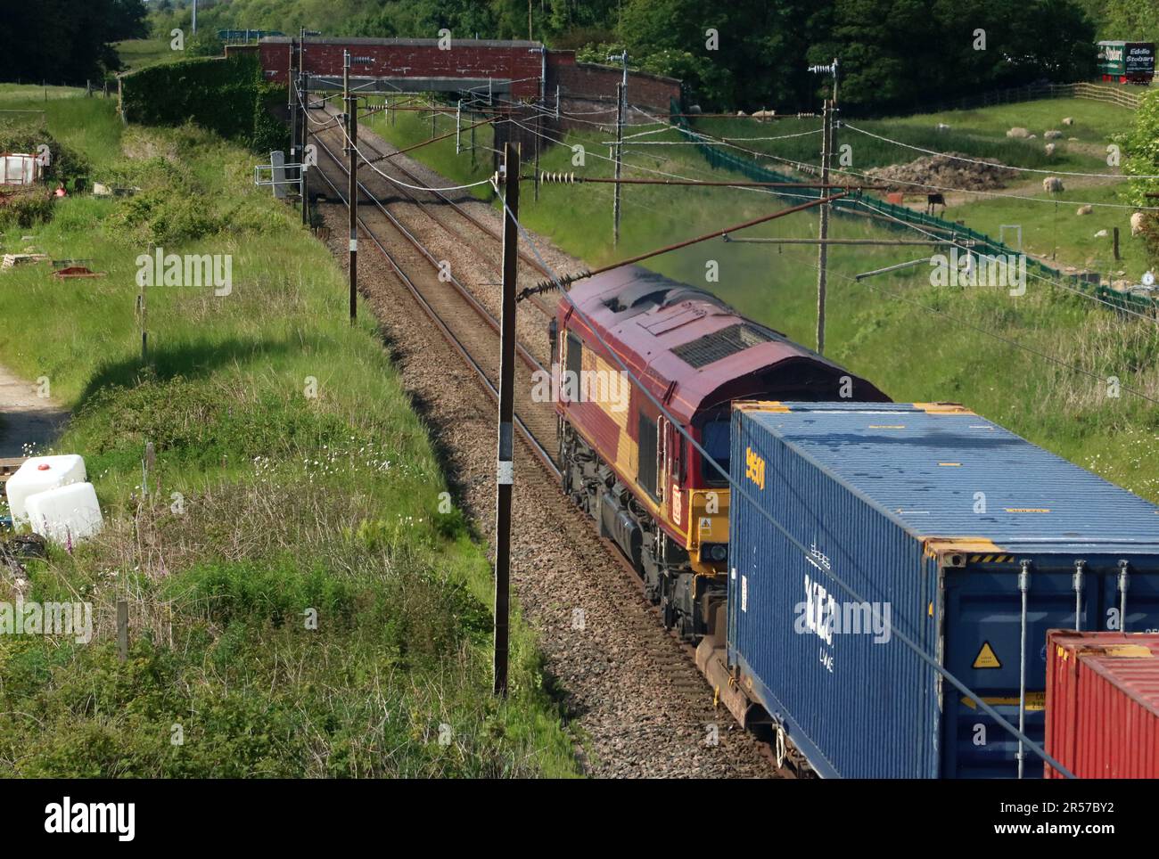 Class 66 diesel-electric shed locomotive on container train on West ...