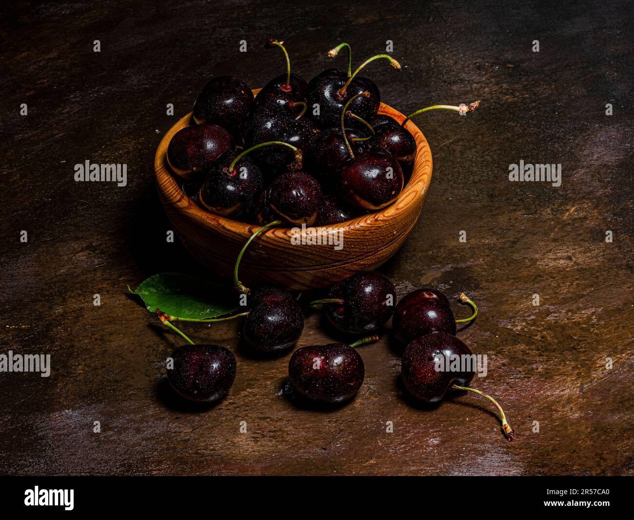 Hand-turned wooden bowl, with cherry picks freshly picked from the tree ...