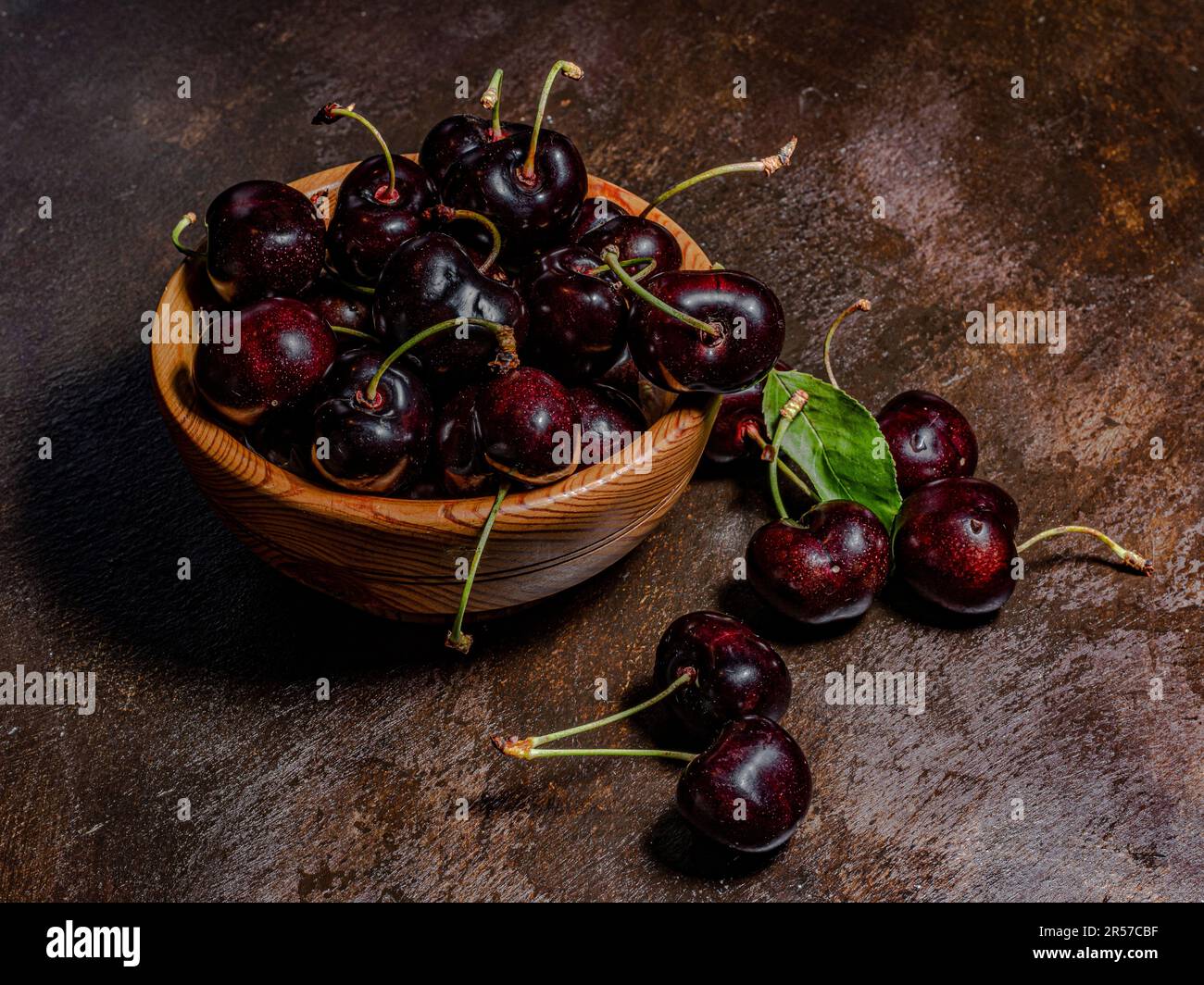 Hand-turned wooden bowl, with cherry picks freshly picked from the tree ...