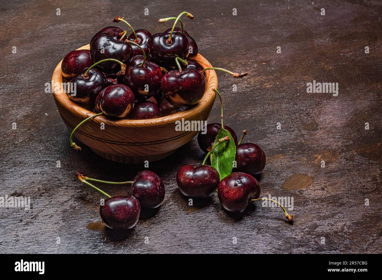 Hand-turned wooden bowl, with cherry picks freshly picked from the tree ...