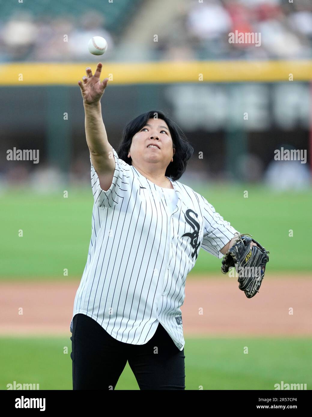 Chicago Alderman Nicole Lee throws out a ceremonial first pitch before ...