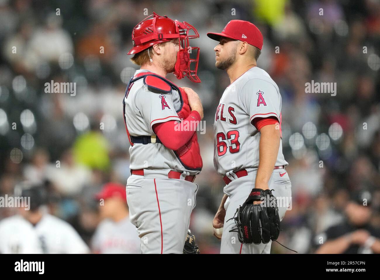 Los Angeles Angels catcher Chad Wallach talks with relief pitcher Chase ...