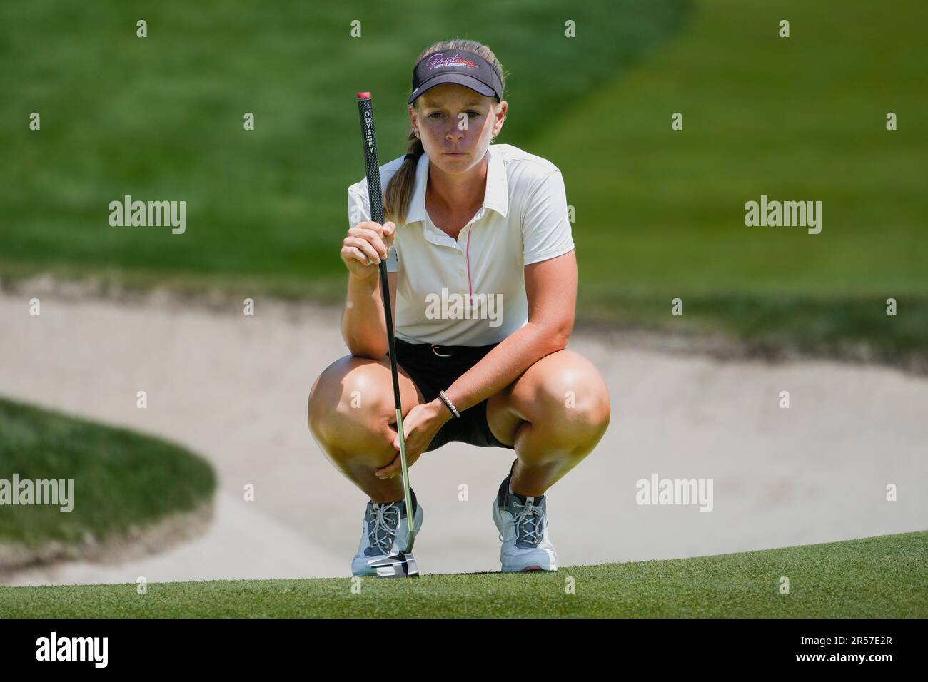 Lauren Hartlage lines up her shot on the eighth green during the first ...