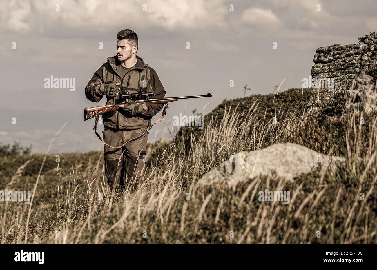 Male with a gun. Hunter with hunting gun and hunting form to hunt ...
