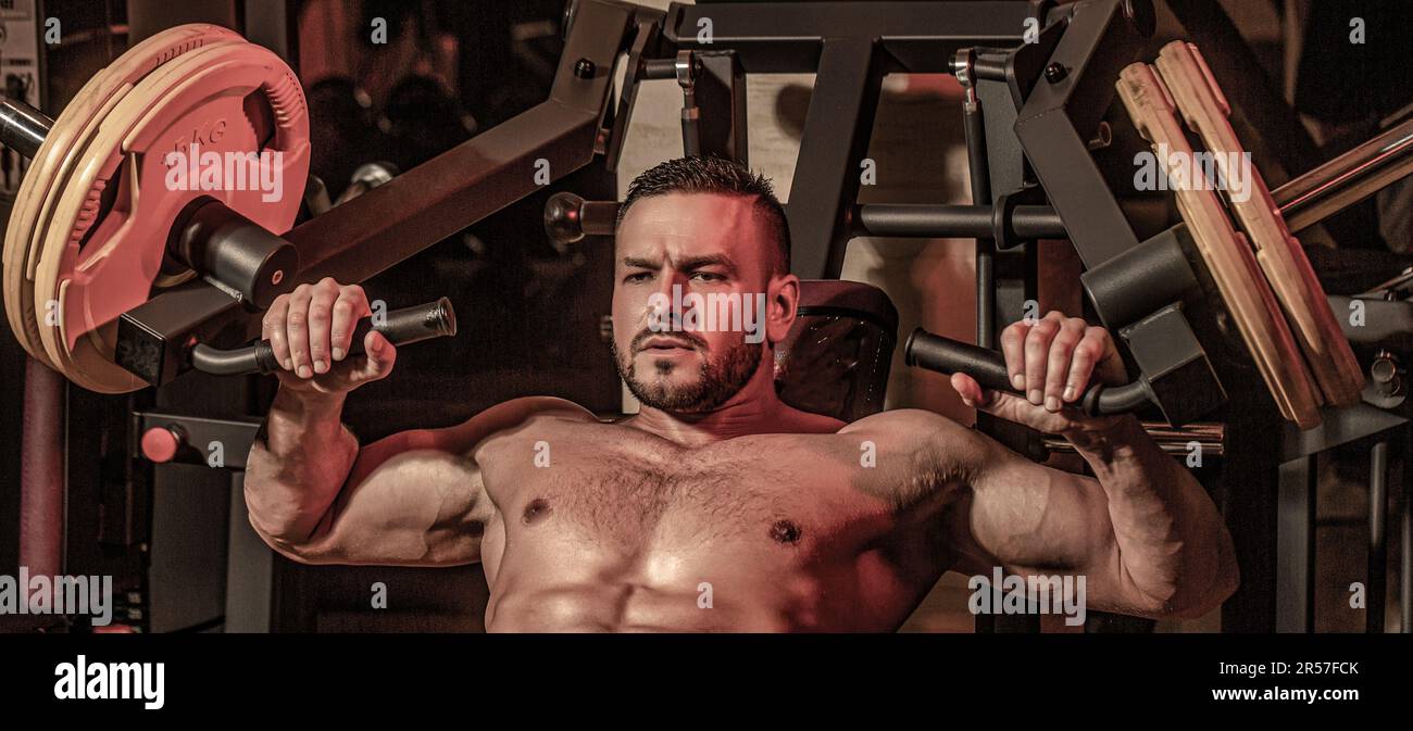 Muscular man workout with barbell at gym. Bodybuilder athletic man with ...