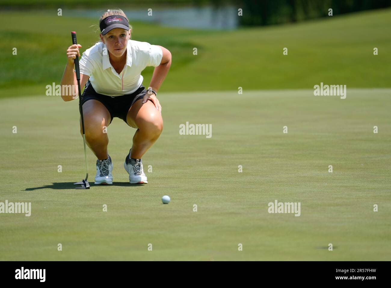 Lauren Hartlage lines up her putt on the ninth green during the first ...