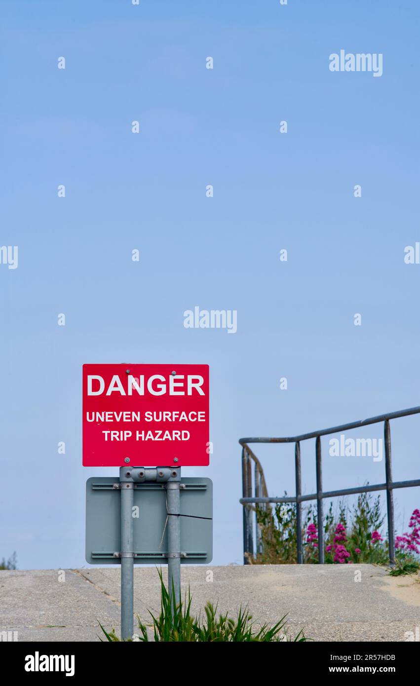 Uneven surface warning sign Martello Bay Clacton on Sea Stock Photo - Alamy