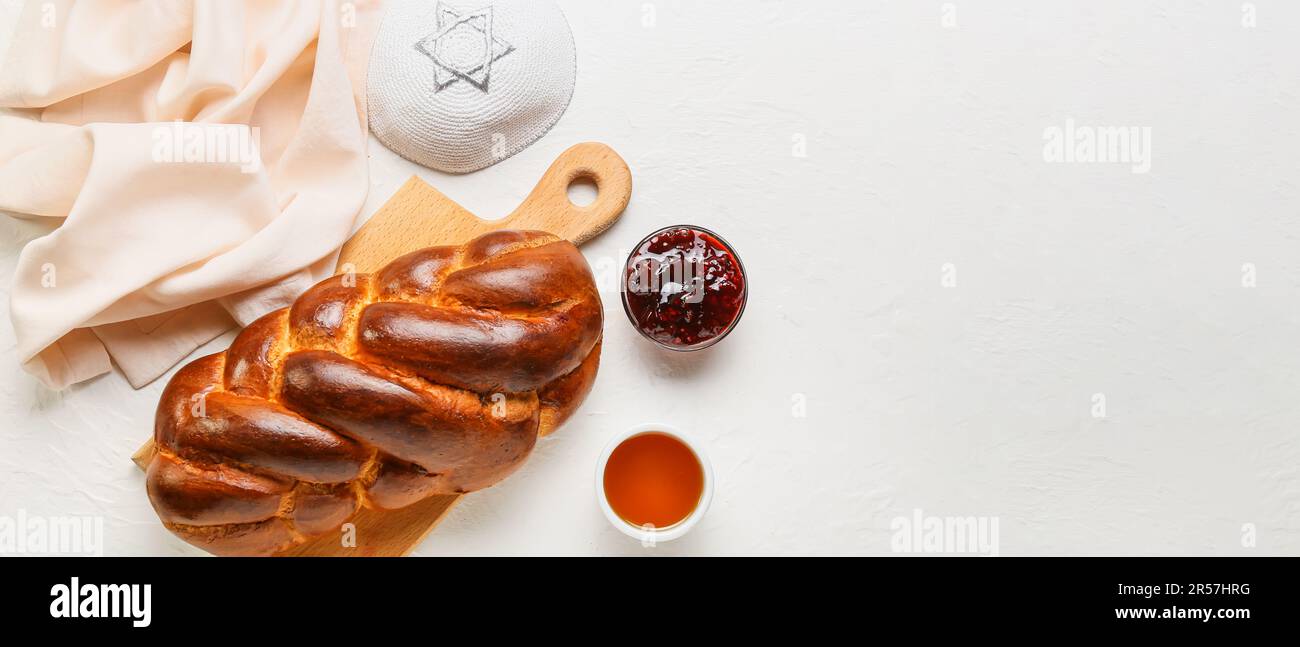 Traditional challah bread with Jewish cap on white background. Banner ...