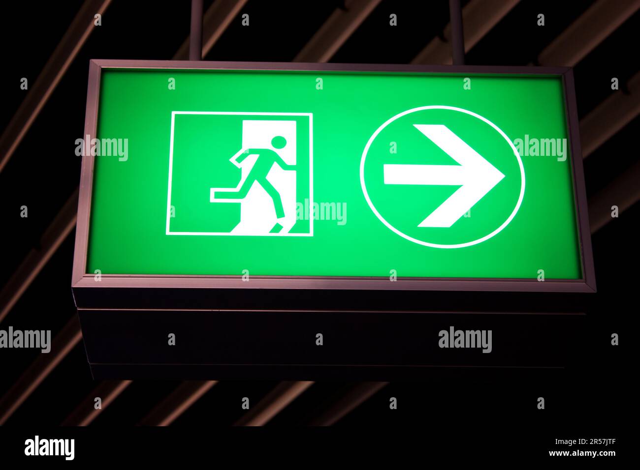 Emergency exit sign in modern offices inside an industrial plant Stock ...