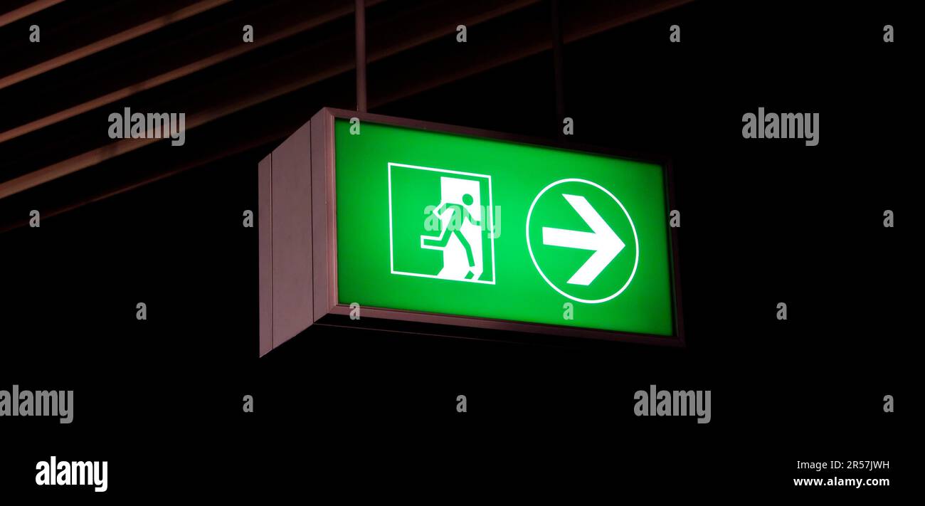 Emergency exit sign in modern offices inside an industrial plant Stock ...