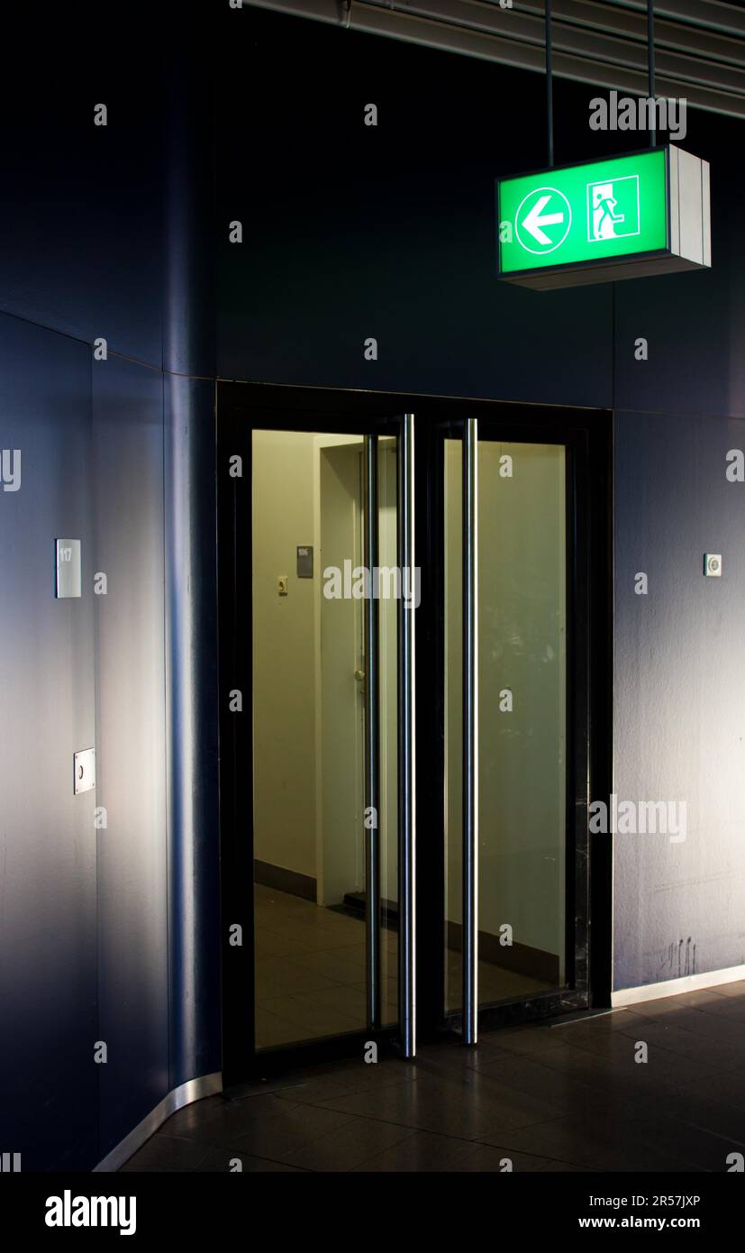 Emergency exit sign in modern offices inside an industrial plant Stock ...