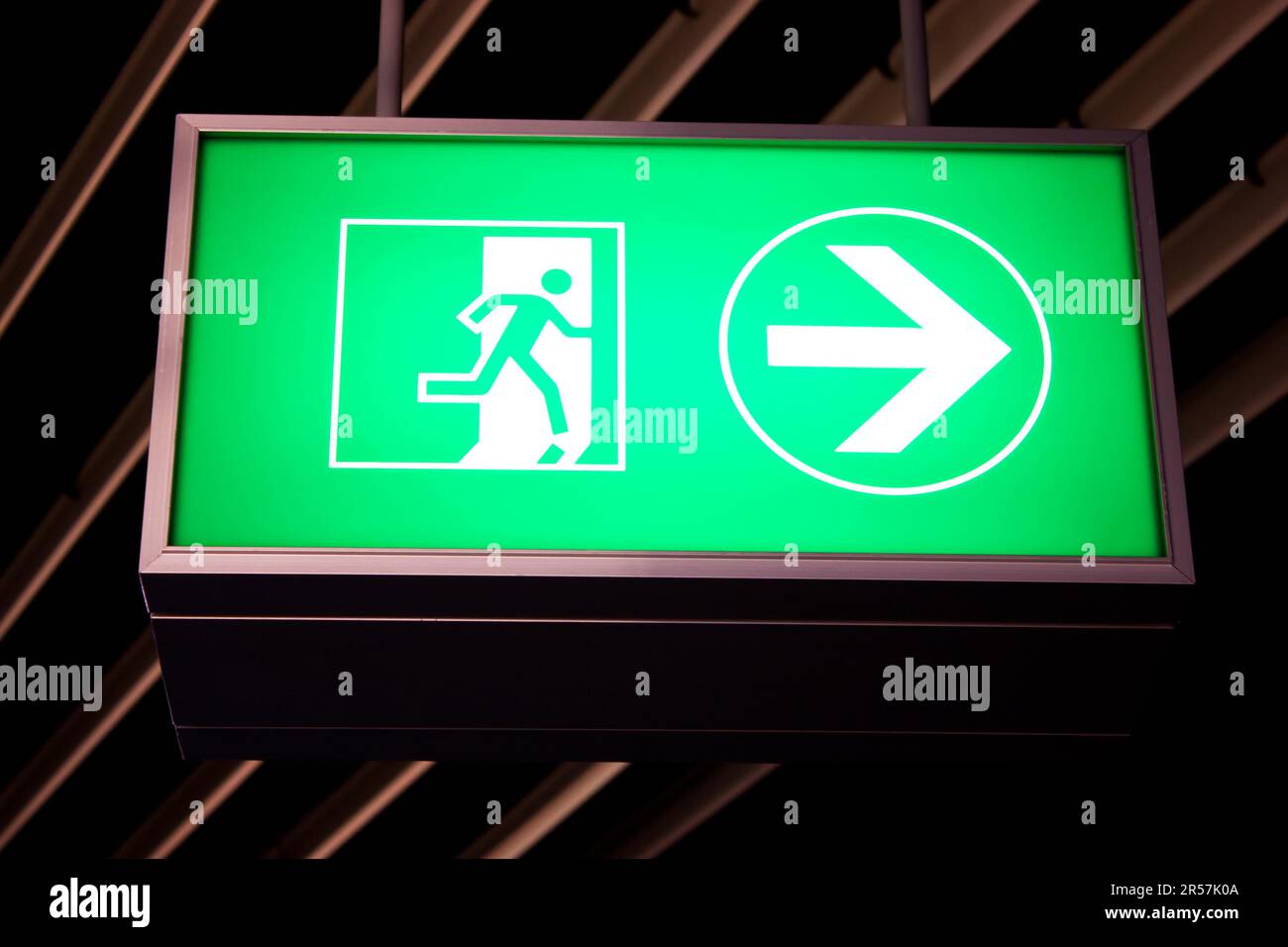 Emergency exit sign in modern offices inside an industrial plant Stock ...