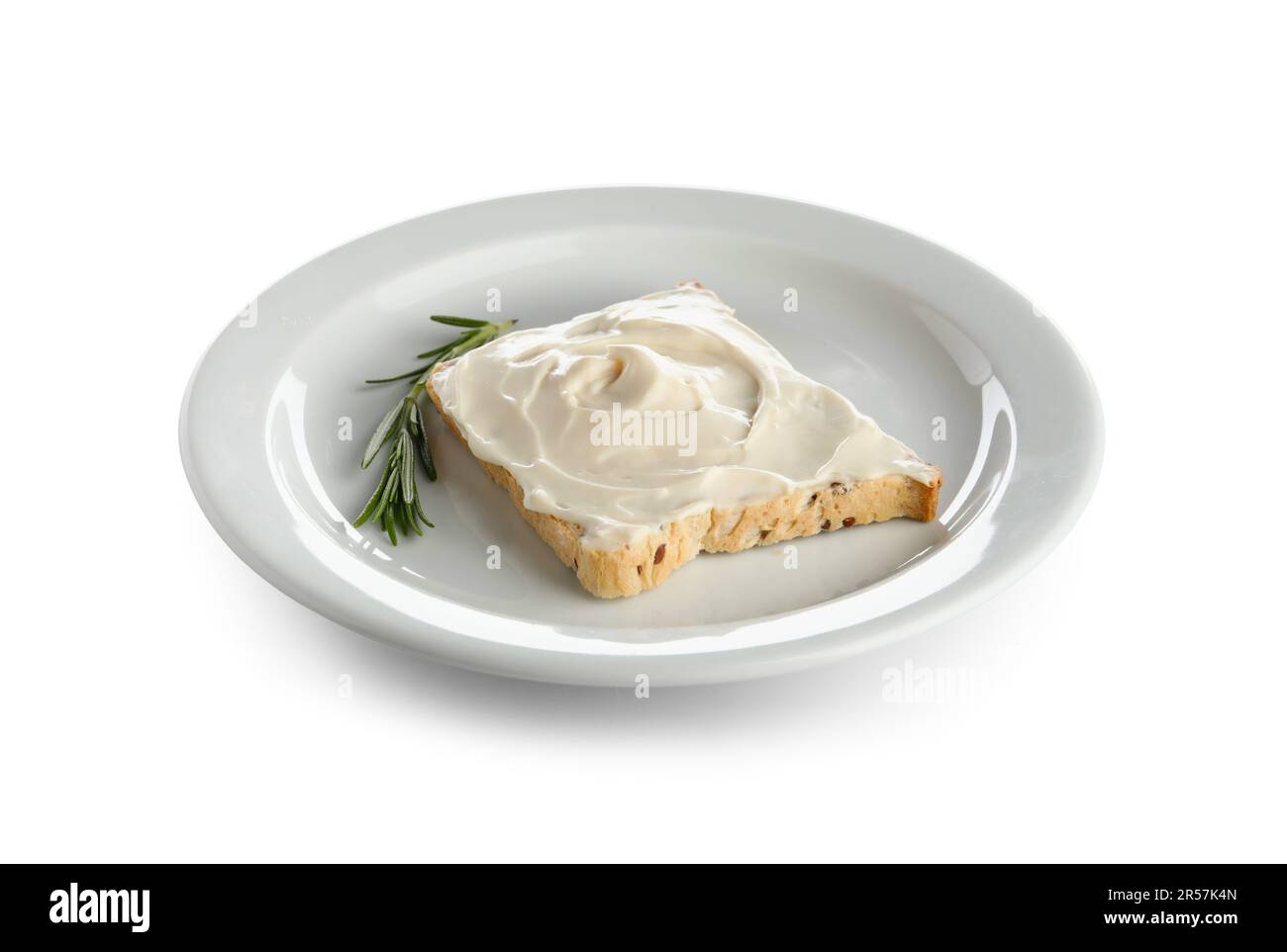 Plate of tasty toast with cream cheese on white background Stock Photo ...