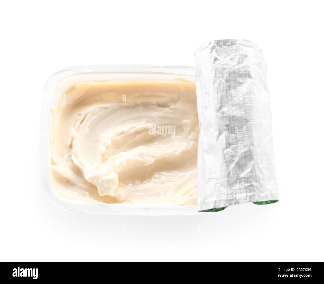 Plastic container with tasty cream cheese on white background Stock ...