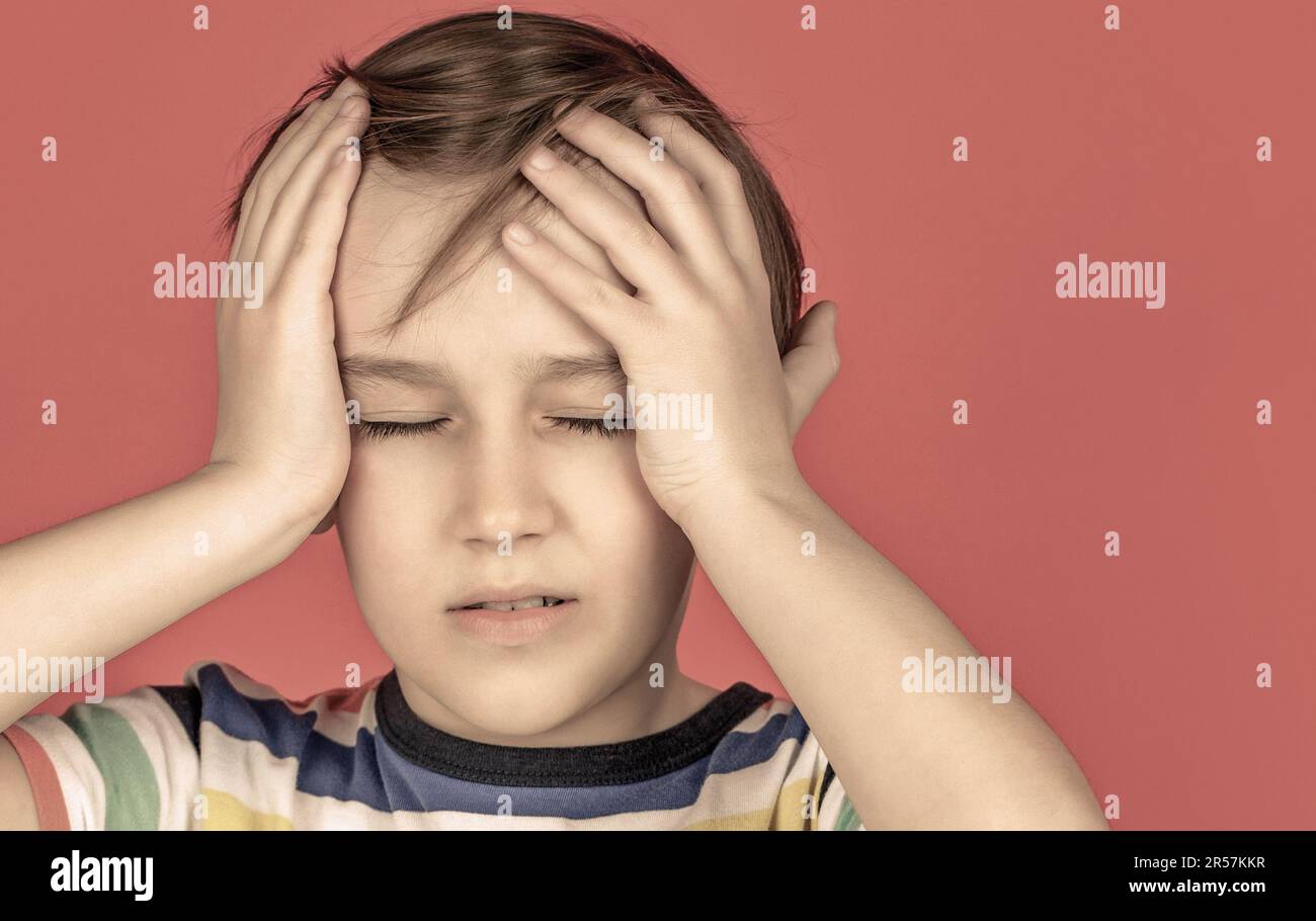 Little boy having a headache. Despair, tragedy. Portrait of a sad boy ...