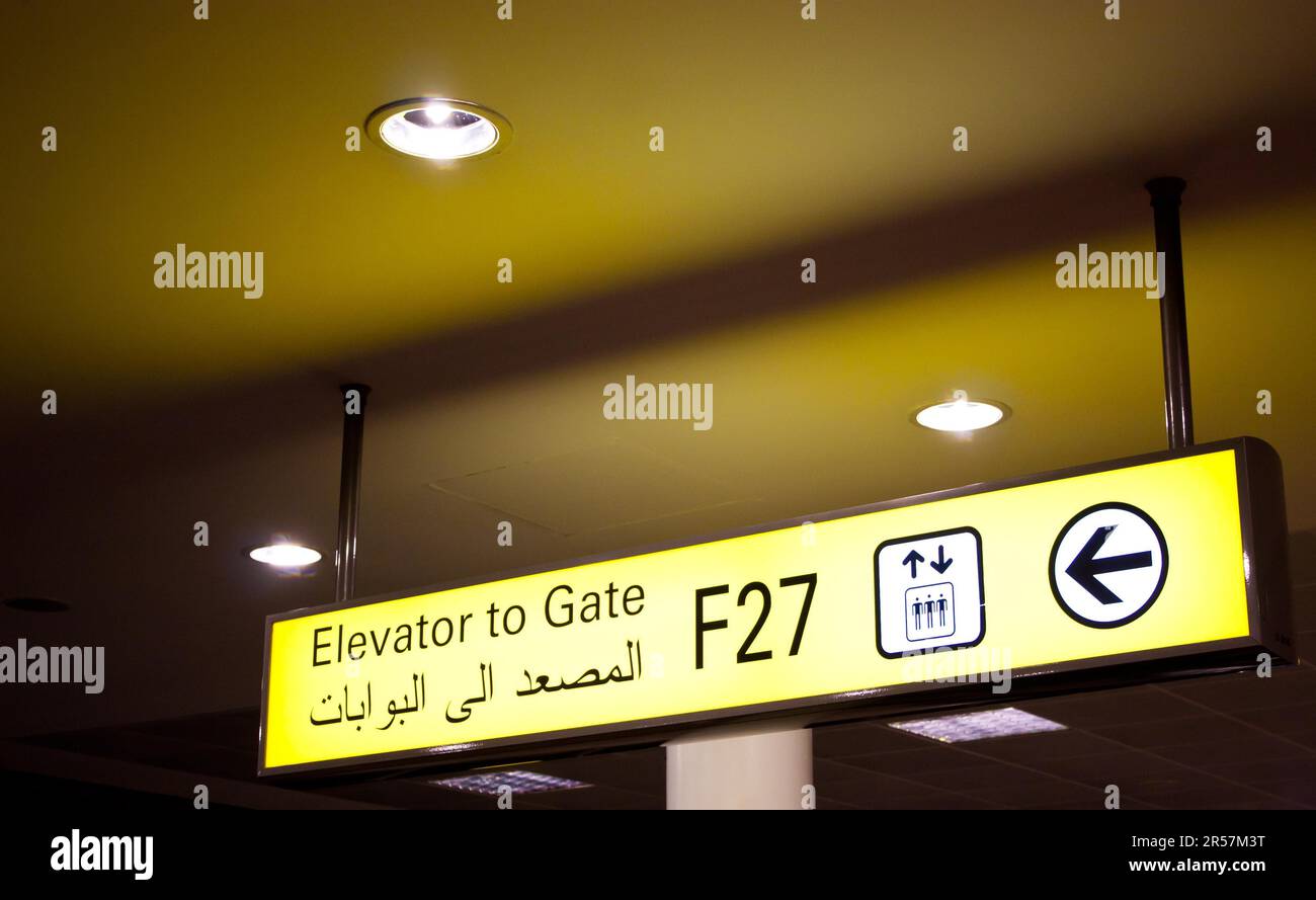 Gate sign in an international airport in Middle East with Arabic ...