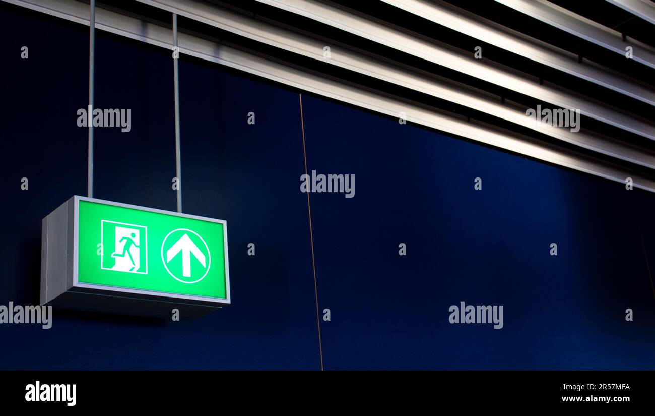 Emergency exit sign in modern offices inside an industrial plant Stock ...