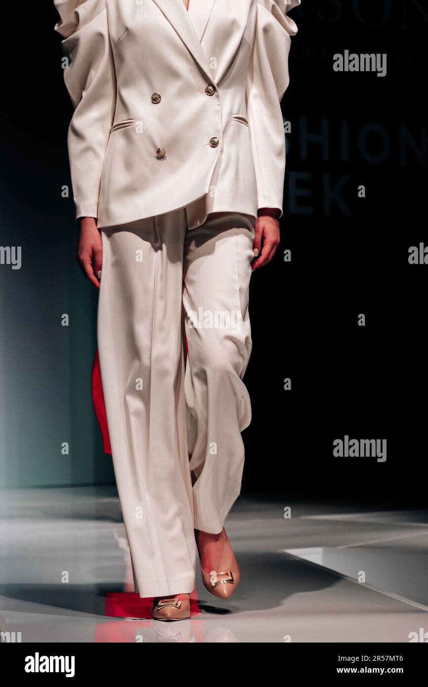 Fashion details of fancy stylish white outfit, classy jacket and pants ...