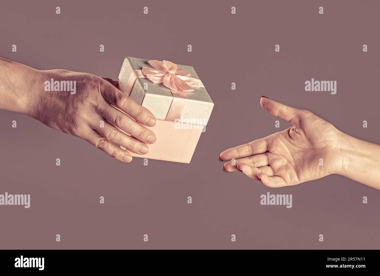 Gift box in hand, surprise and holiday concept. Man hands holding ...