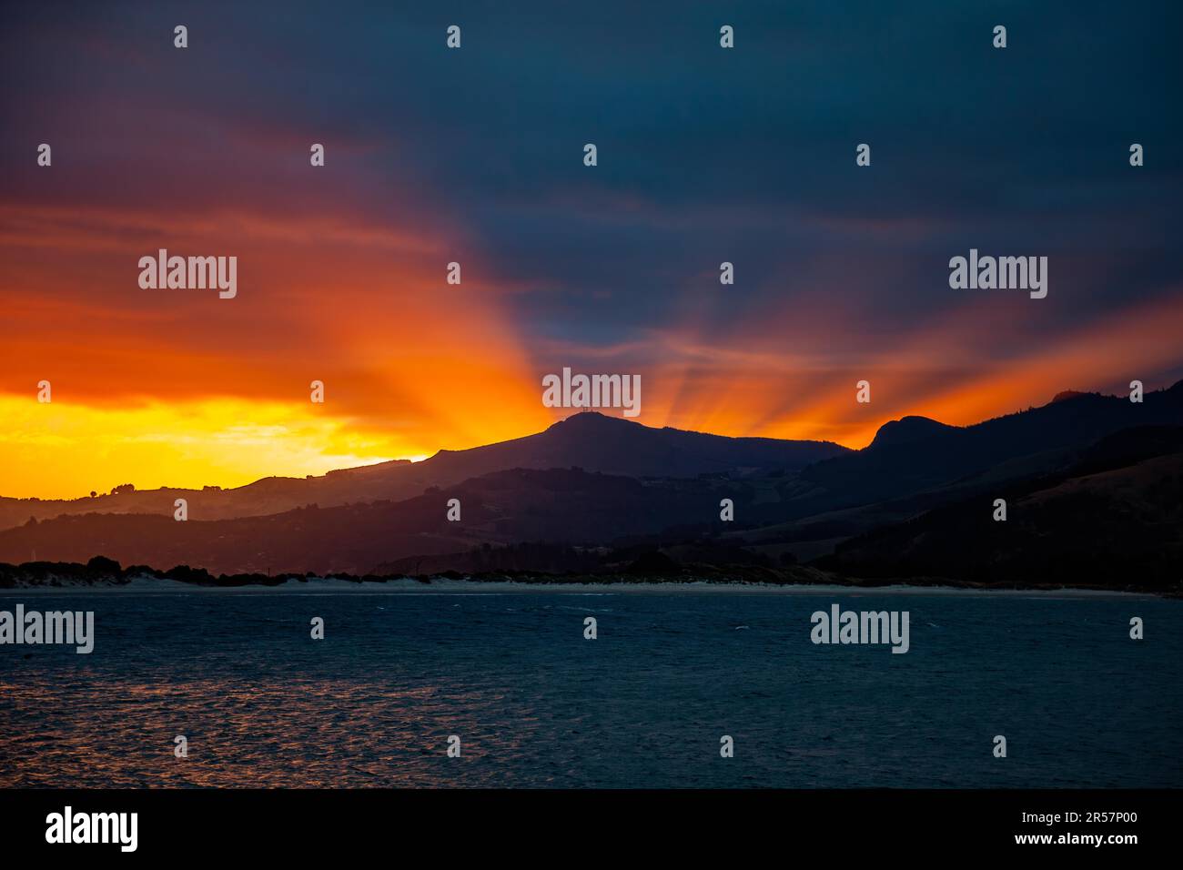 Sunset over Pilot Bay in New Zealand Stock Photo - Alamy