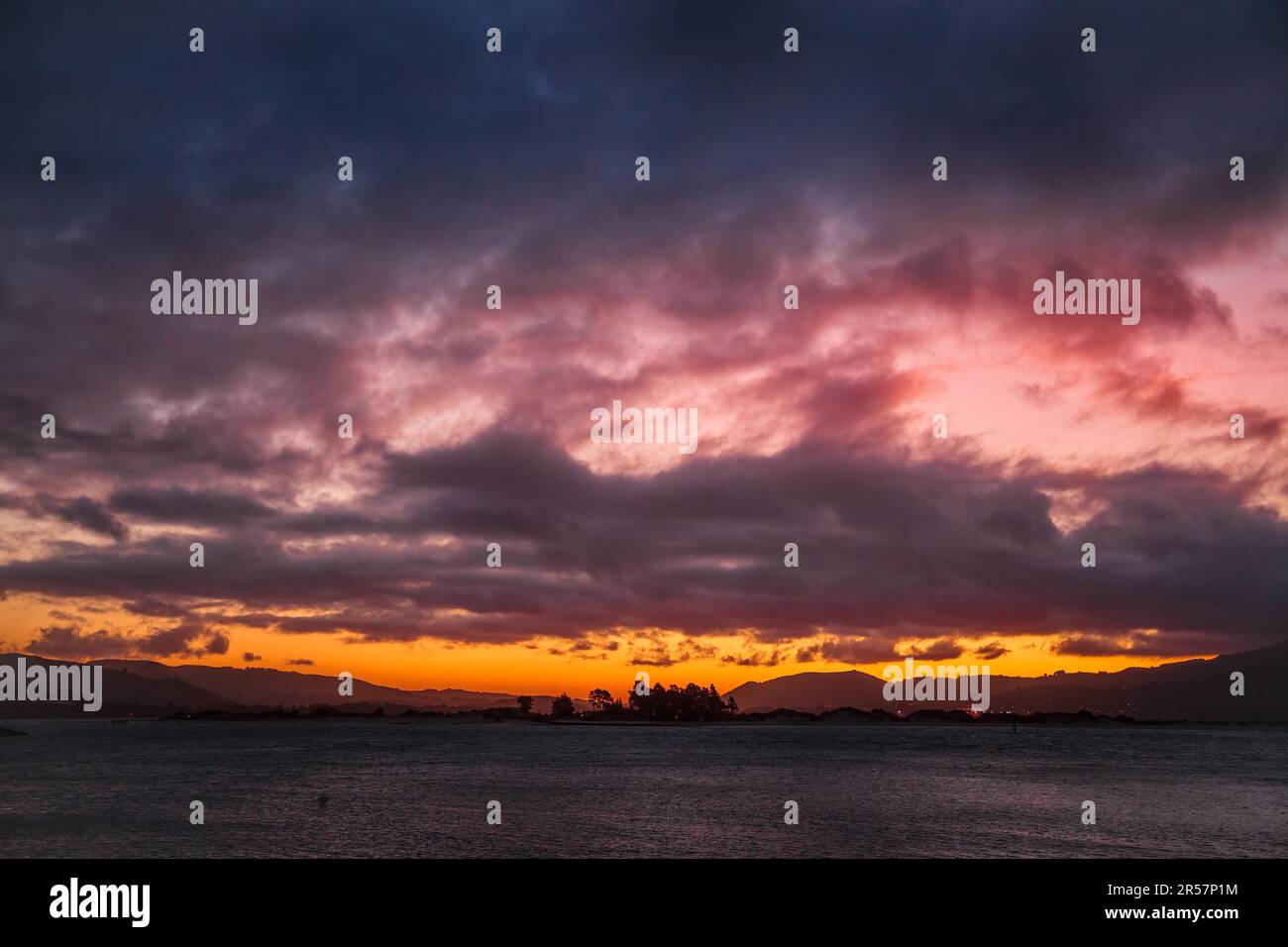 Sunset over Pilot Bay in New Zealand Stock Photo - Alamy