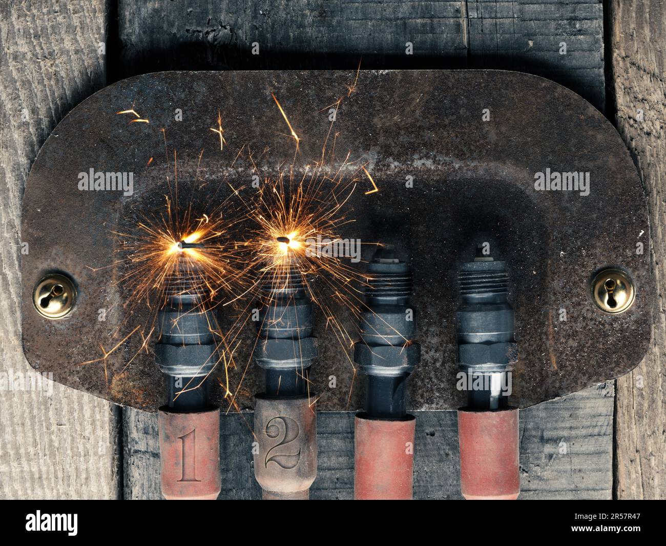 Second Advent background with four spark plugs on rusty sign, car ...