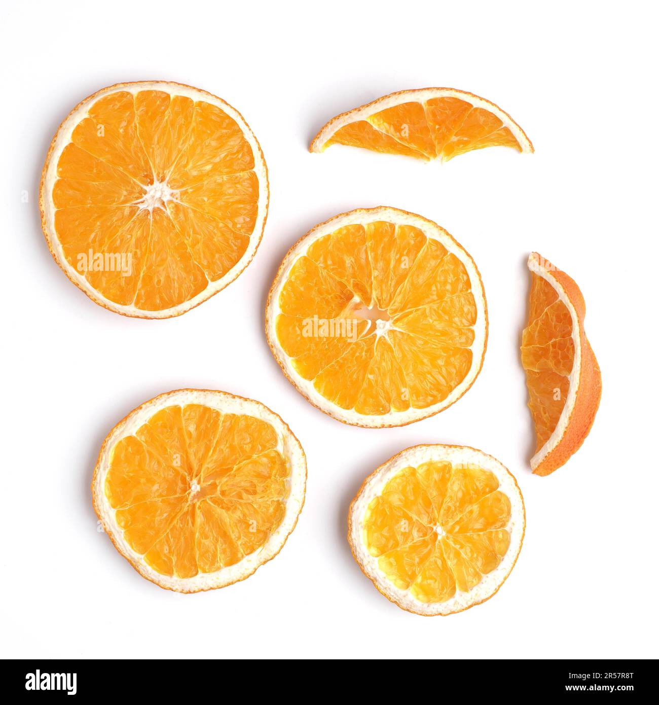 Dried orange fruit slices on a white background, food or Christmas ...