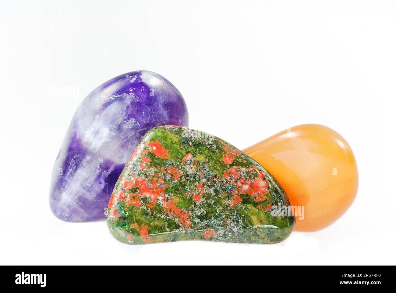 Smooth colourful pebble stones isolated on white Stock Photo - Alamy