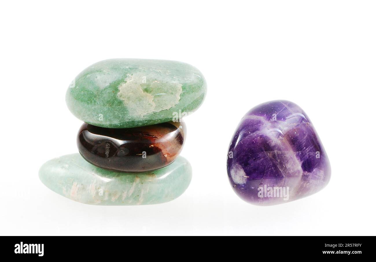 Smooth colourful pebble stones isolated on white Stock Photo - Alamy