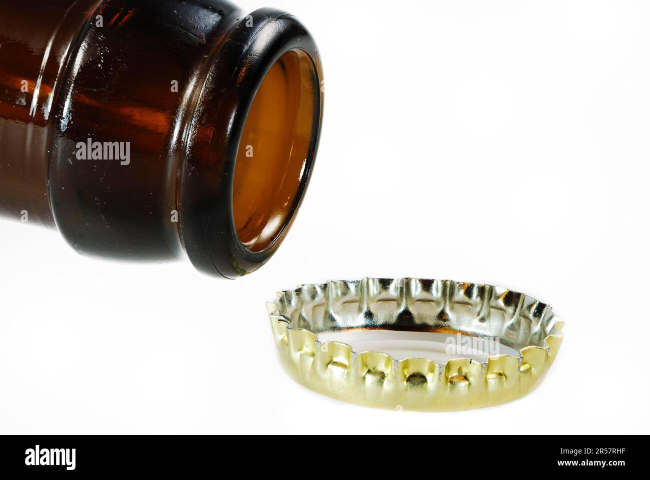 Open beer bottle and a crown cap Stock Photo - Alamy