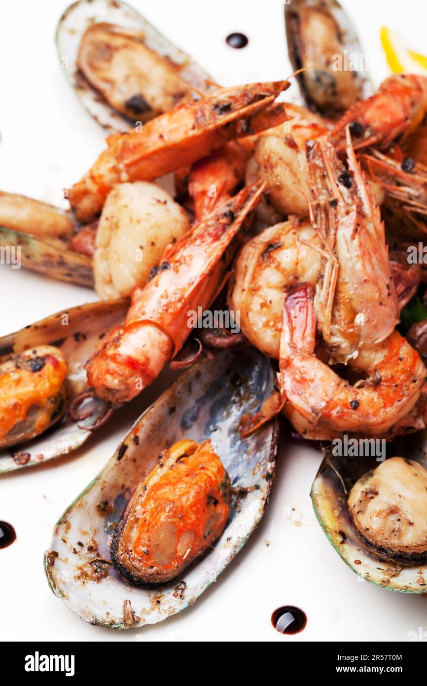 mussels and shrimp prepared on white plate Stock Photo - Alamy