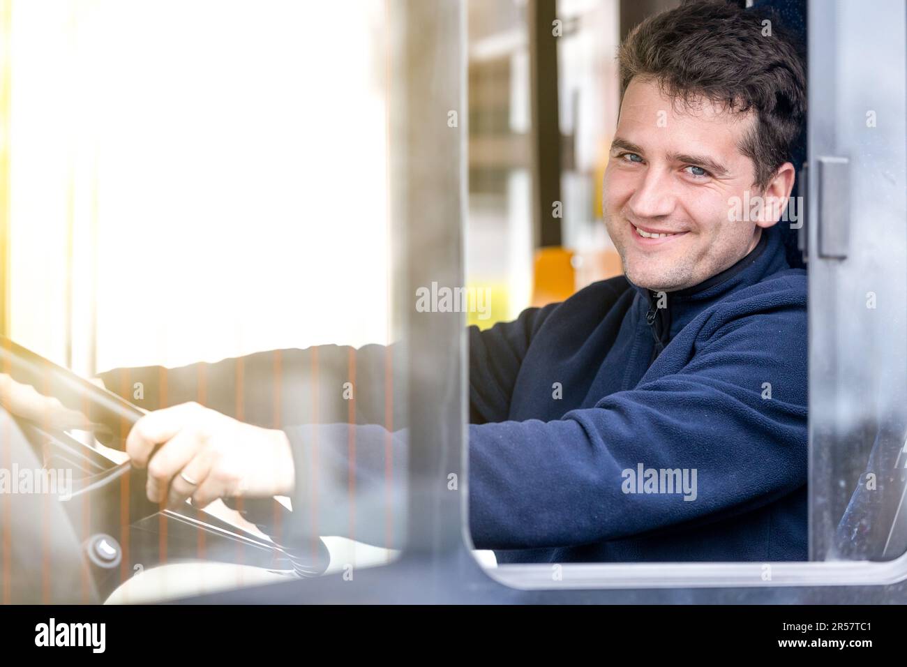 Portrait of handsome bus driver of public transport, concept of urban ...