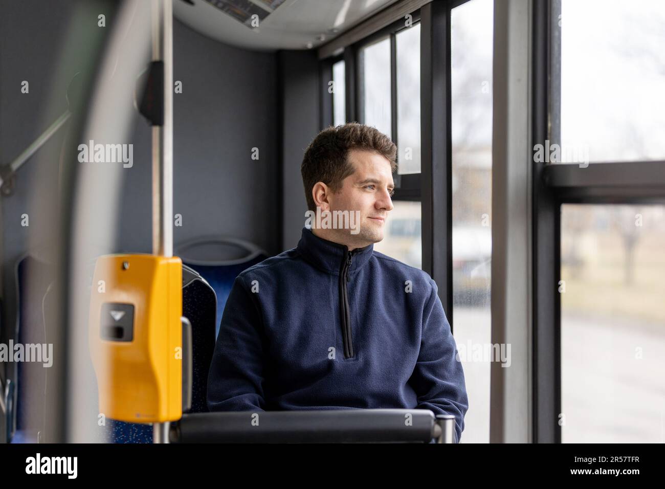Male bus passenger in the public bus transport, concept of an urban ...