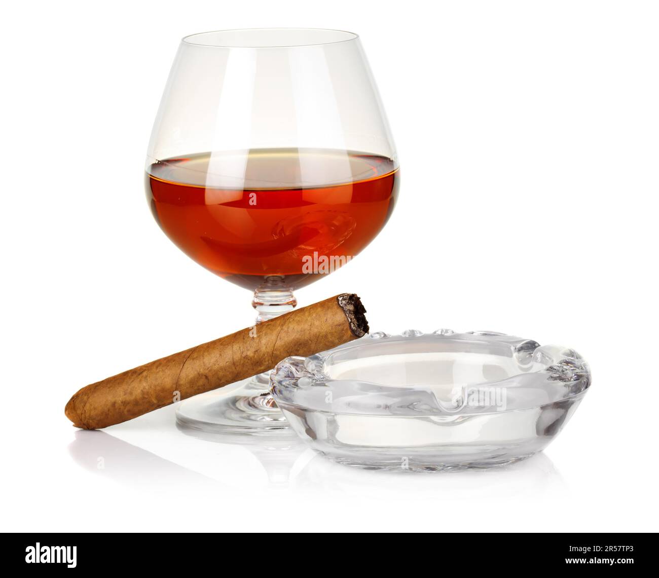 Cognac in glass with cigar and ashtray isolated on white background ...