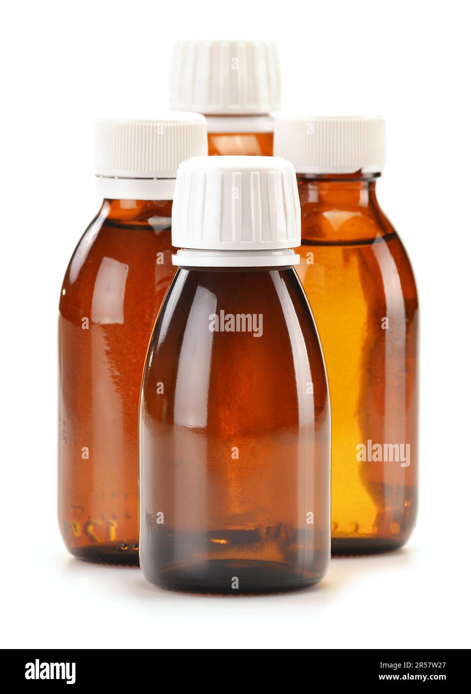 Bottles of syrup medication on white background Stock Photo - Alamy