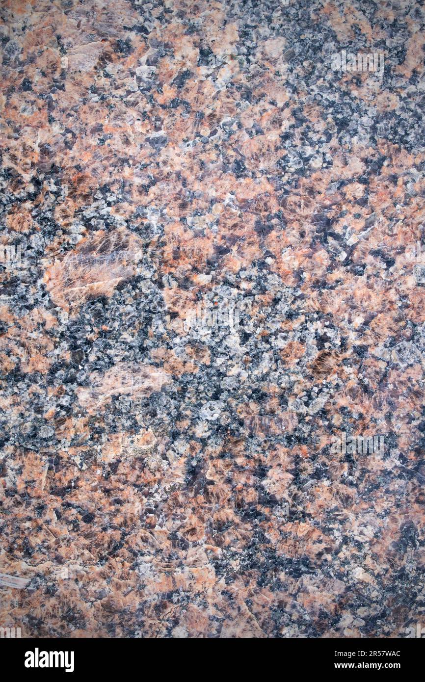 Bright red black granite stone close up, background or texture Stock ...