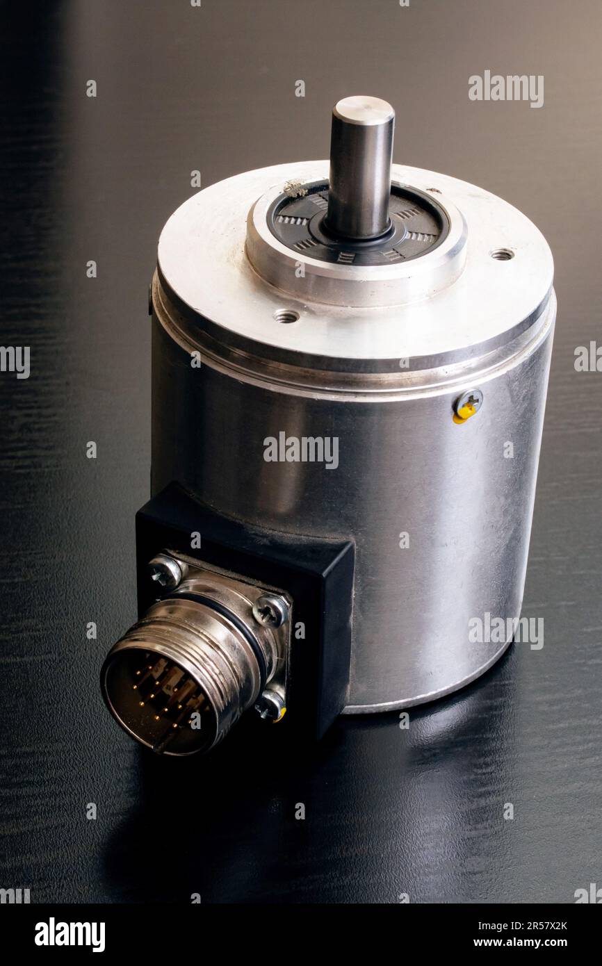 Metal encoder on a black wooden table close up Stock Photo - Alamy