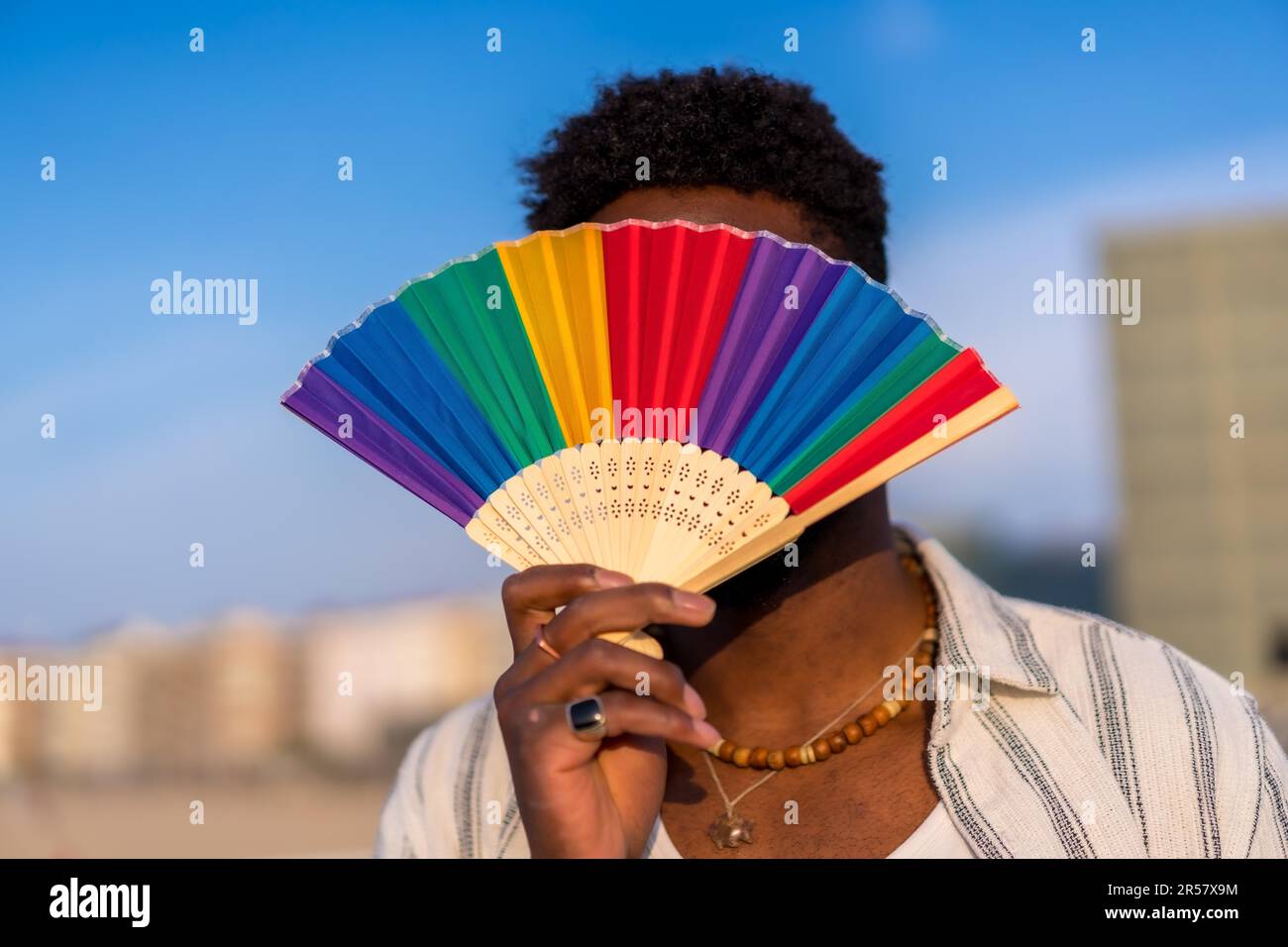 Colorful rainbow fan during gay pride, LGBT collective fan ...