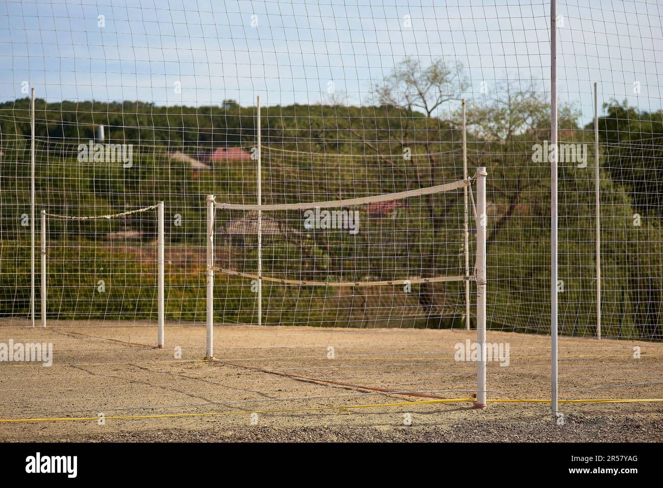 Volleyball fields, courts fenced with a net Stock Photo - Alamy
