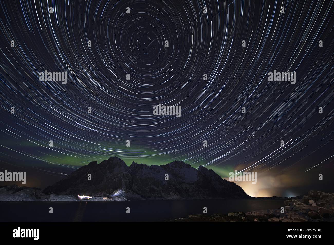 Star trails with some northern lights and rain clouds near Henningsvaer ...
