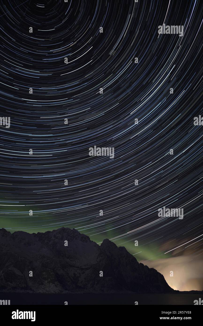 Star trails with some northern lights and rain clouds near Henningsvaer ...