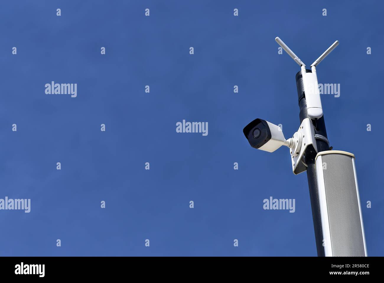 surveillance cameras and a warning system. CCTV cam on a pillar against ...