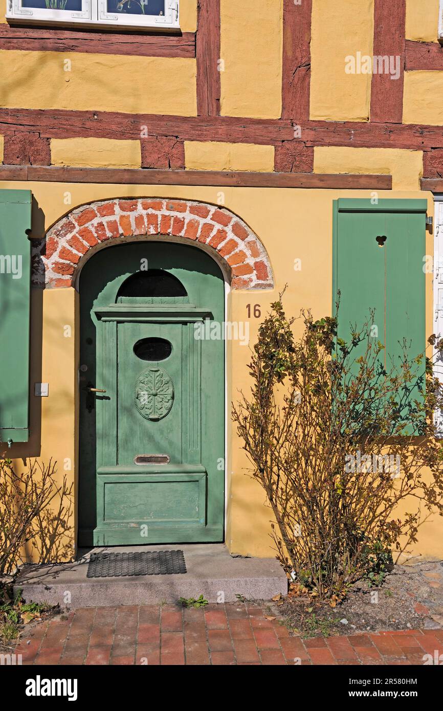 Old front door, restored half-timbered houses, grounds of ...
